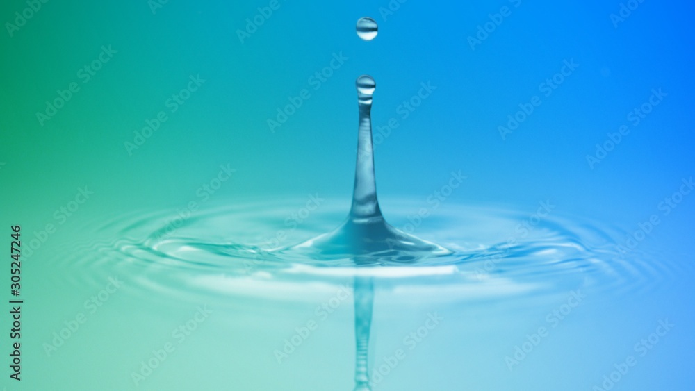 Water drop surface collision with circular puddle effect in blue and ...
