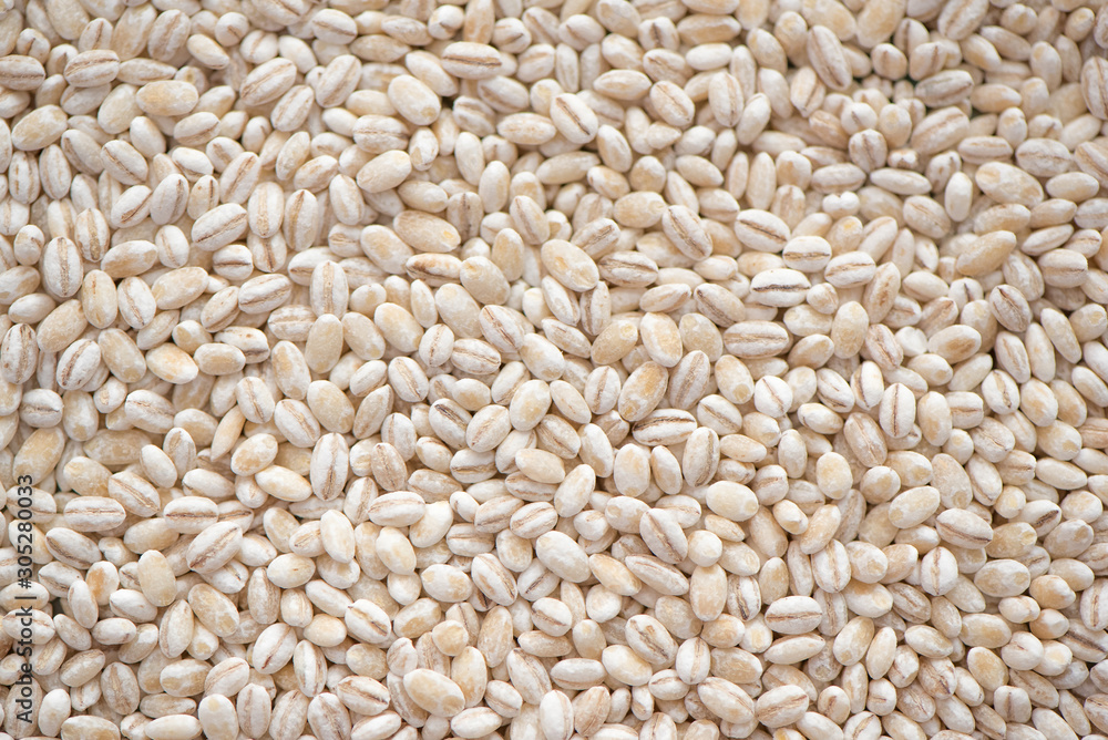 Dry pearl barley grain seed close-up textured background, top view ...