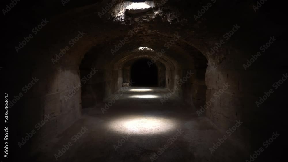 Pass through a long and dark Roman basement. Basement under the ...