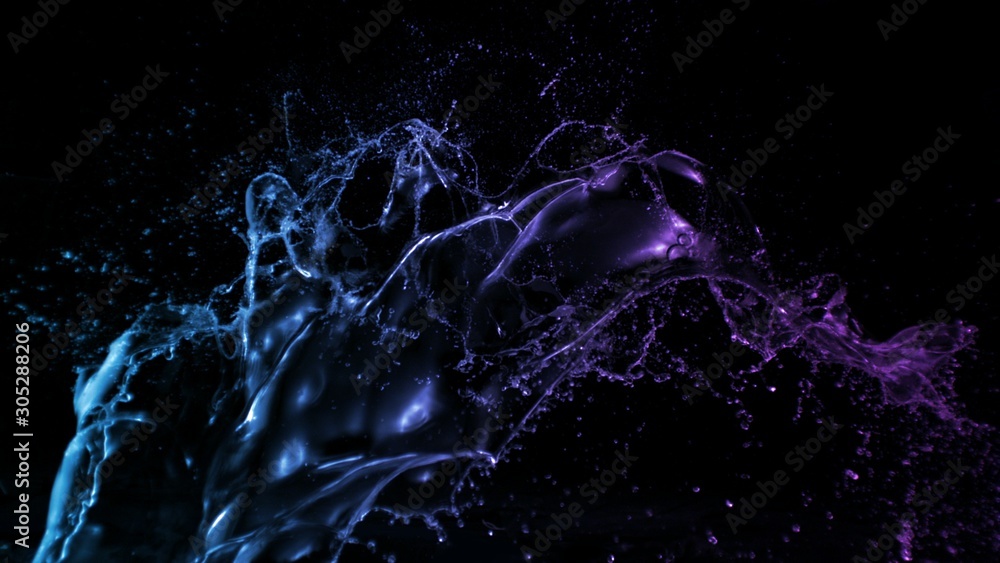 colourful isolated liquid water splash in purple and blue light on ...