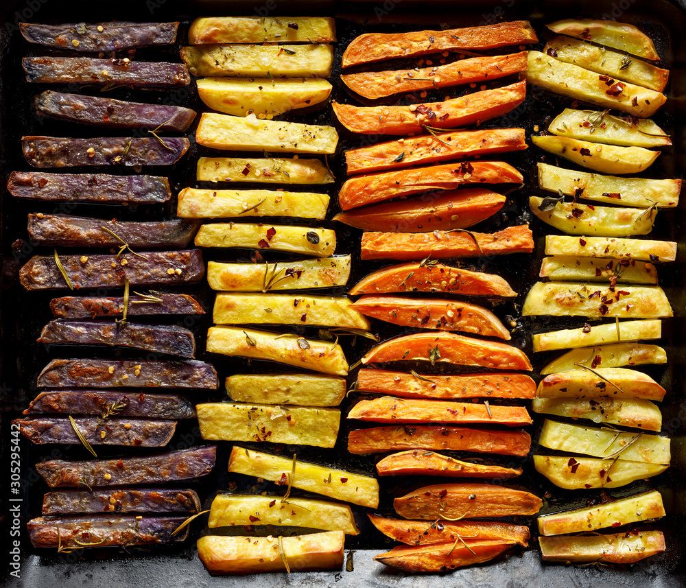 French fries, baked fries from different types and colors of potatoes ...