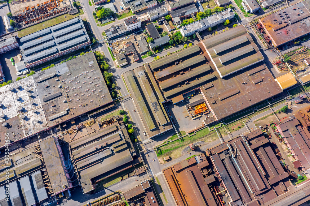 city industrial zone with factories, rows of warehouses and storages ...