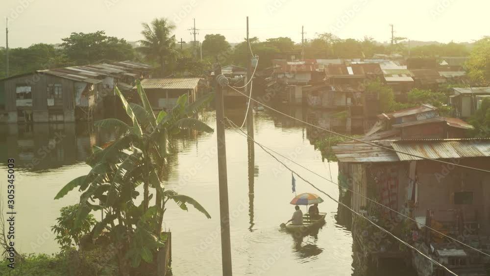 People paddling home in the late evening sunset at the Artex Compound ...
