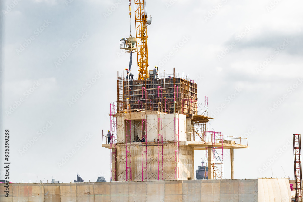 Aerial view of a building construction site in progress with tower ...