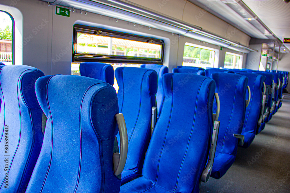 Empty interior of the train for long and short distance. Seats for ...