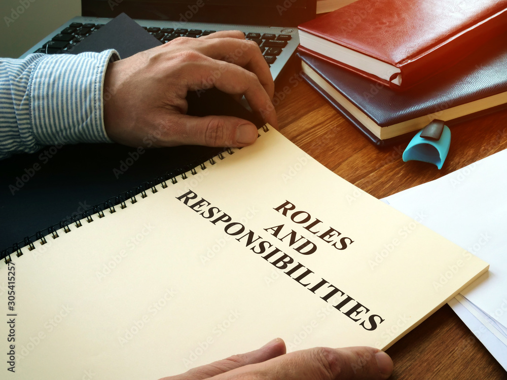 Roles And Responsibilities book on the desk. Stock Photo | Adobe Stock