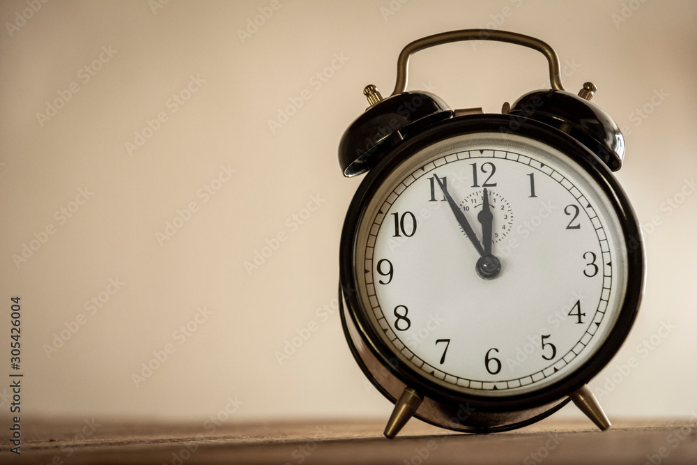 Vintage and retro analogue clock indicating that time's almost up, it's ...