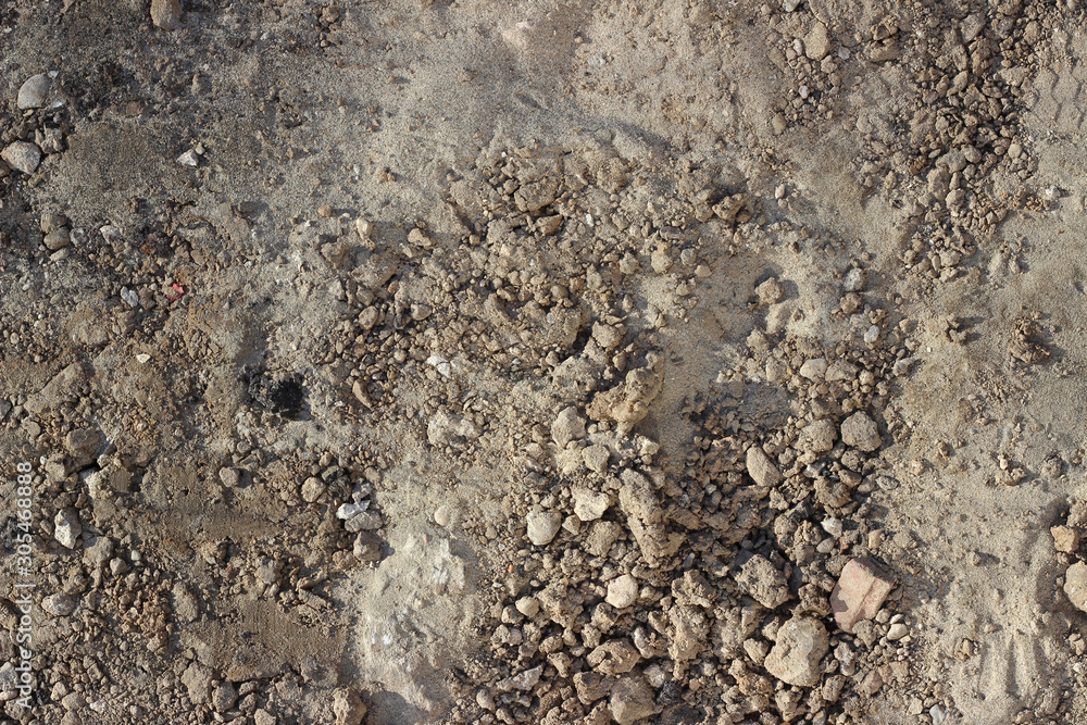 Construction site detail with sand, cement, ground and stones, rubble ...