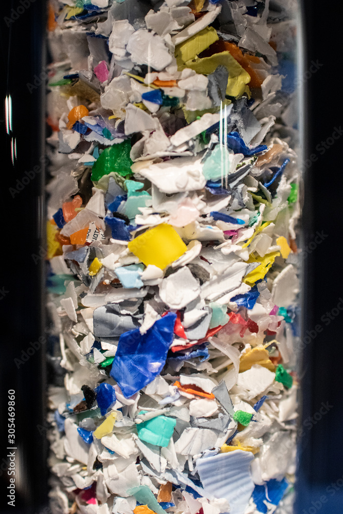 Poster microplastic flakes in a cylinder to teach recycling of plastics ...