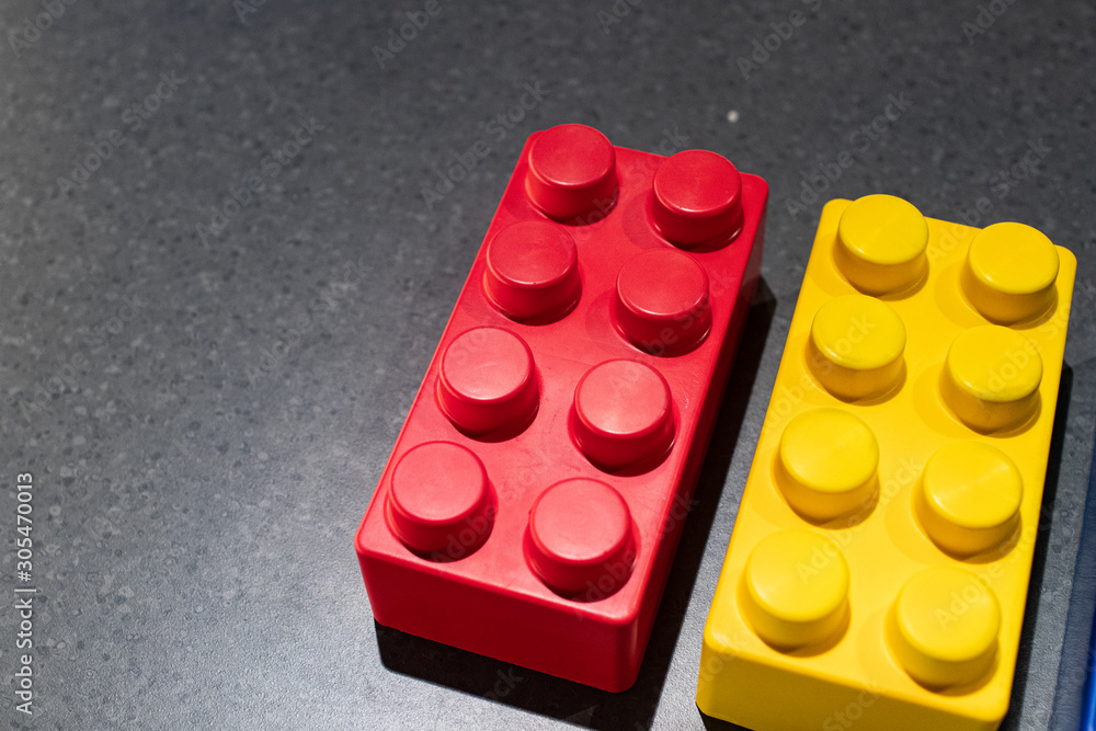 rectangular building blocks for children in yellow, blue and red colors ...