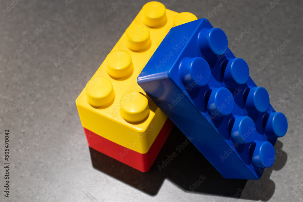 rectangular building blocks for children in yellow, blue and red colors ...
