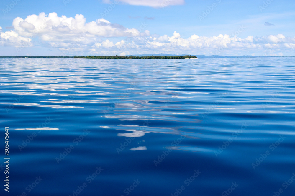 Clean and blue ocean and white beach in Papua New Guinea Stock Photo ...