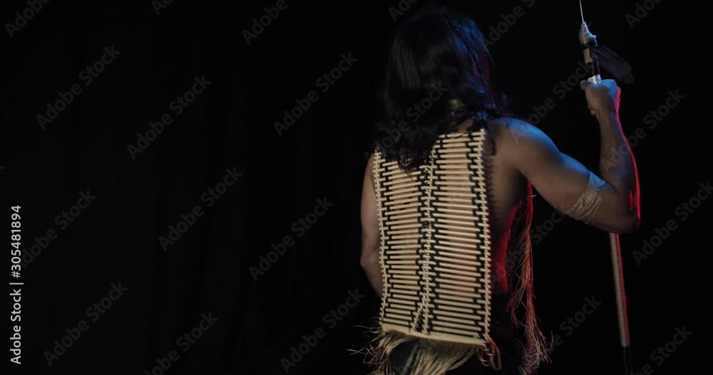 Muscular native american in traditional clothes, with a spear, jumping ...