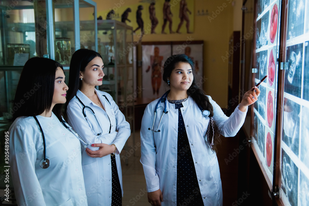 A group of surgeon interns is studying fetal development at different ...