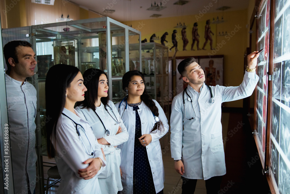 A group of surgeon interns is studying fetal development at different ...