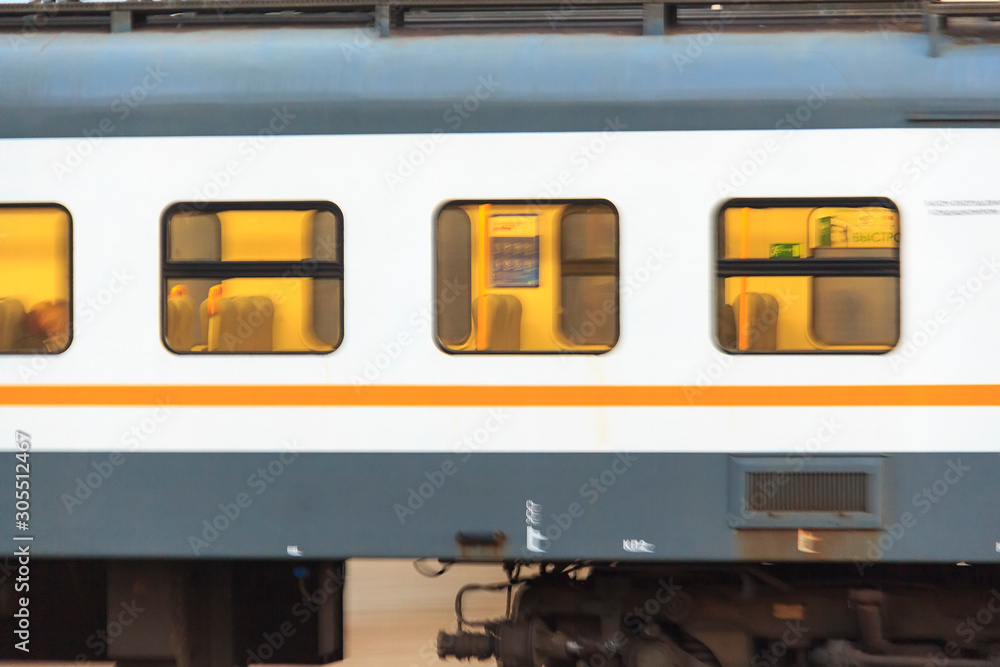 Blurred stripes and tracing from headlights. Electric train in motion ...