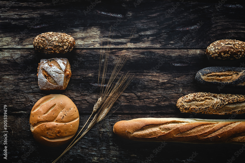 Gold assortment bread homemade on dark wood background, captured from ...