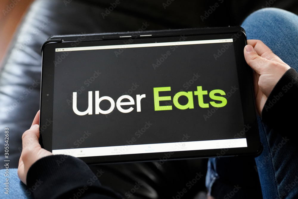 Uber Eats sign logo tablet home application food delivery app Stock ...