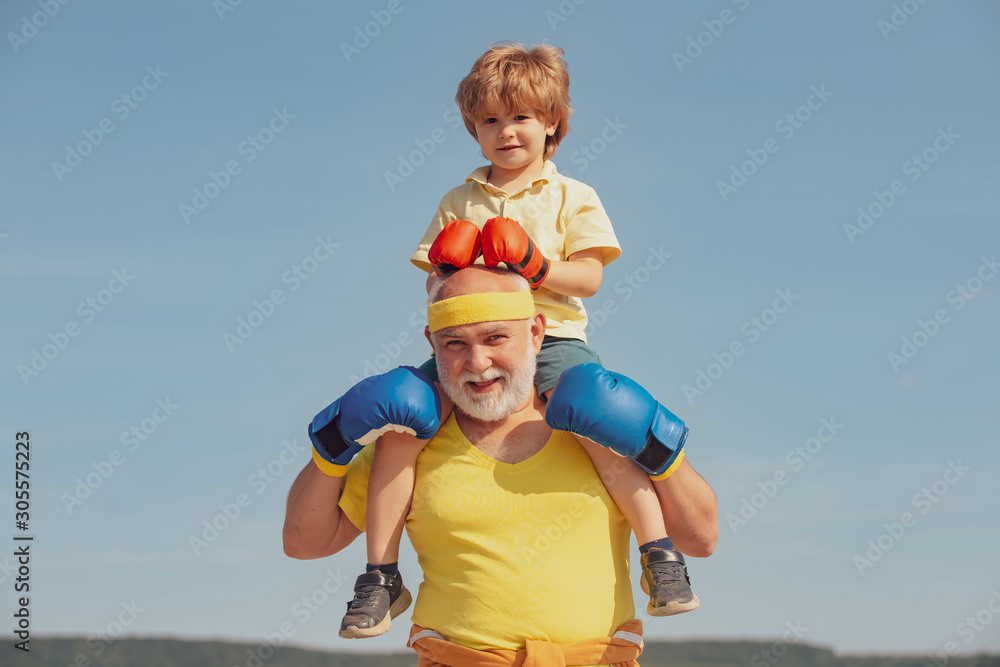 Grandfather and child fighting poses. Grandpa and little child boy in ...