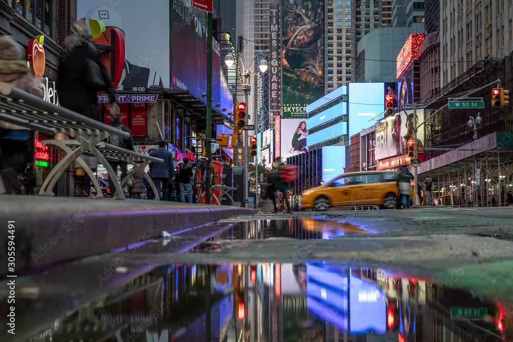 Ground level shot of a street scene in Manhattan conveying the hectic ...