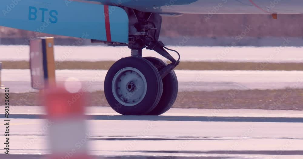 The wheels of the front landing gear of an aircraft that moves to the ...