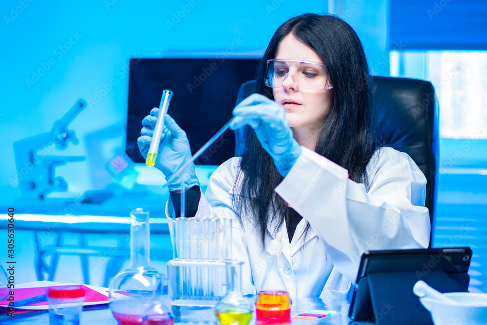 Girl conducts chemical experiments. Concept - Laboratory Assistant ...