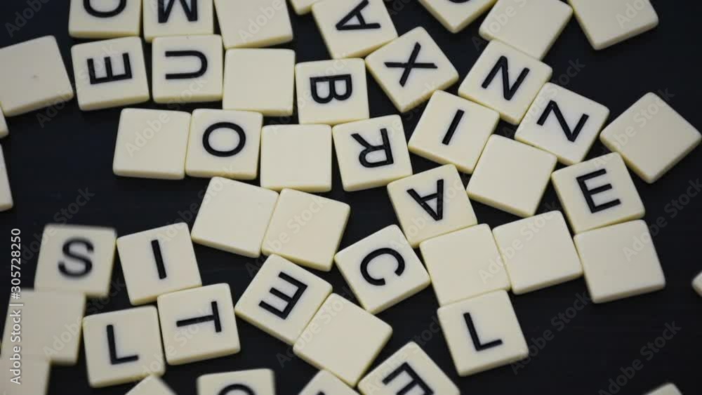 Jumbled letters on a black background. Business concept for joining ...