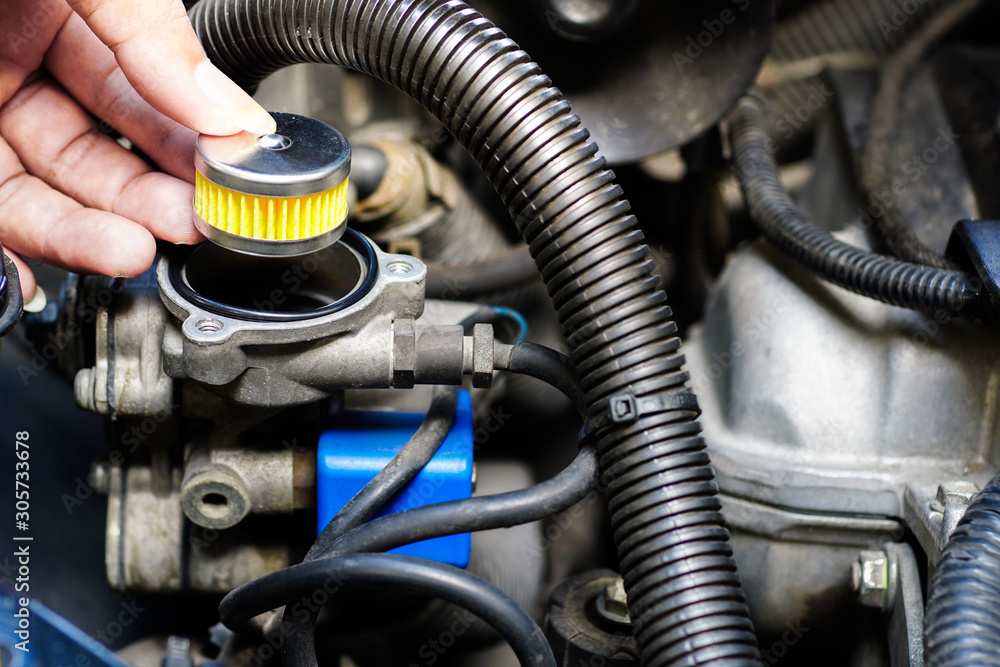 LPG filter are installed in to a car for the 2 fuel system. Stock Photo ...