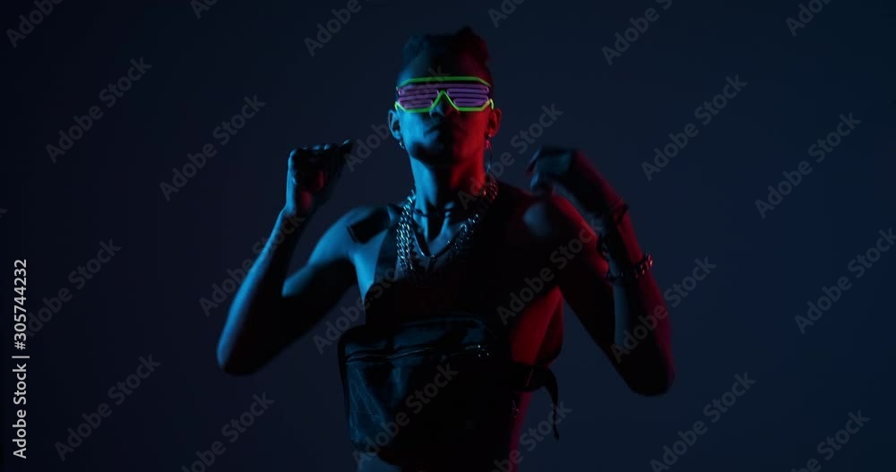 Shirtless african man dancing at rave party with bag and glowing ...
