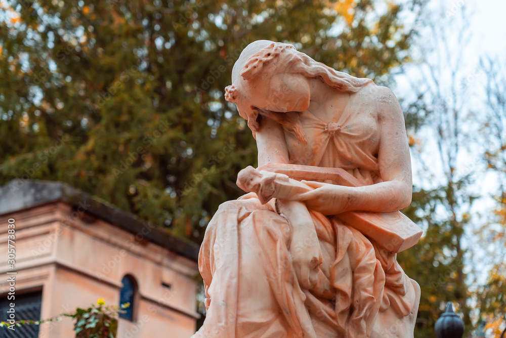 Old stone woman monument in the most famous cemetery of Paris Pere ...