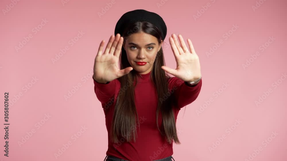 Angry annoyed woman raising hands up to say no stop. distrustful look ...