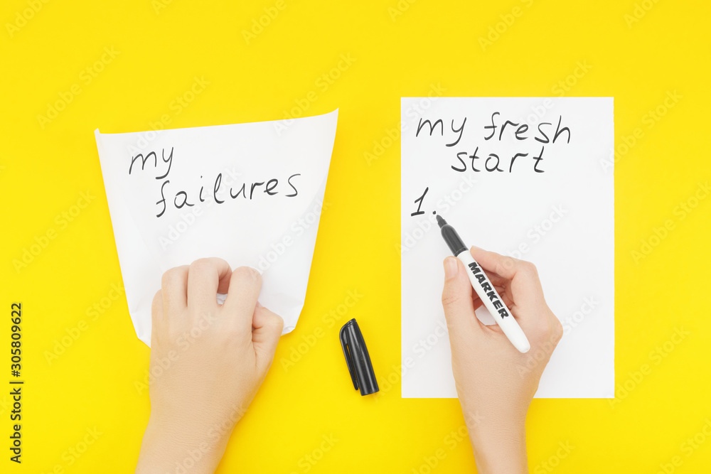 Hand wrinkles a piece of paper with the phrase: My failures, and writes ...