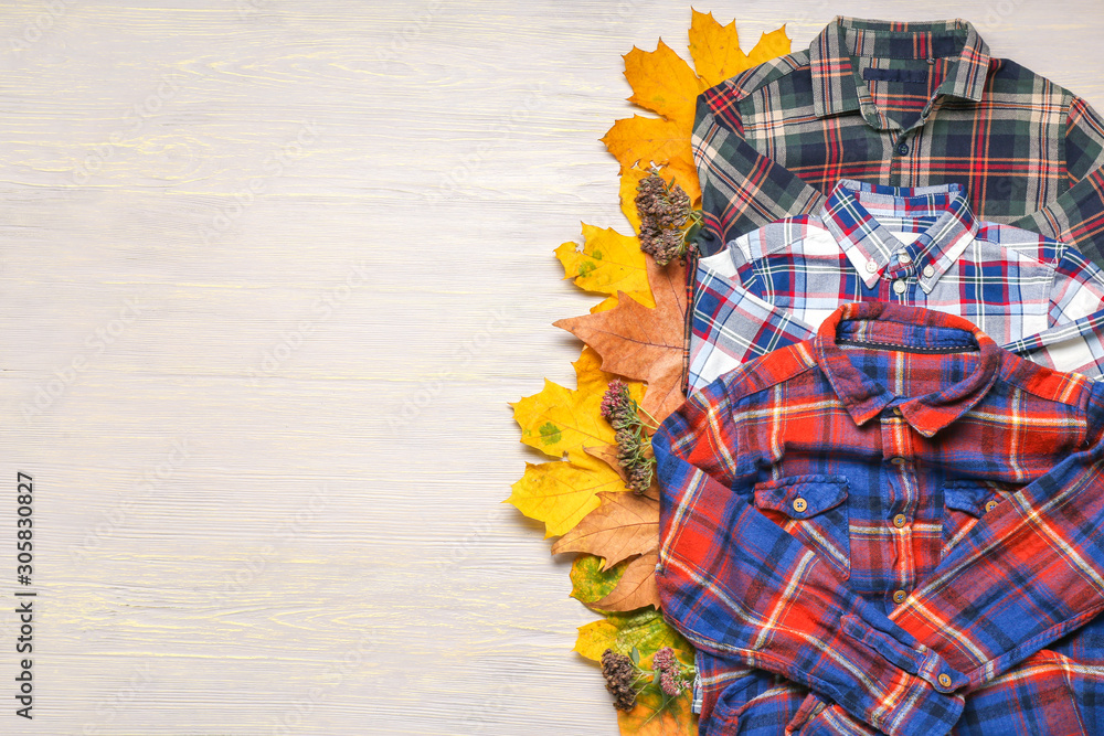 Stylish autumn kid clothes with leaves on wooden background Stock Photo ...