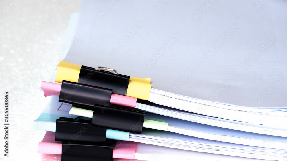 Stack of office working document with paper clip folder separated group ...