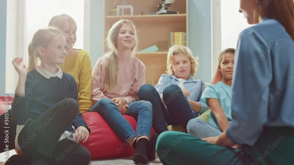Elementary School Creativity Class: Children Sitting on the Carpet ...