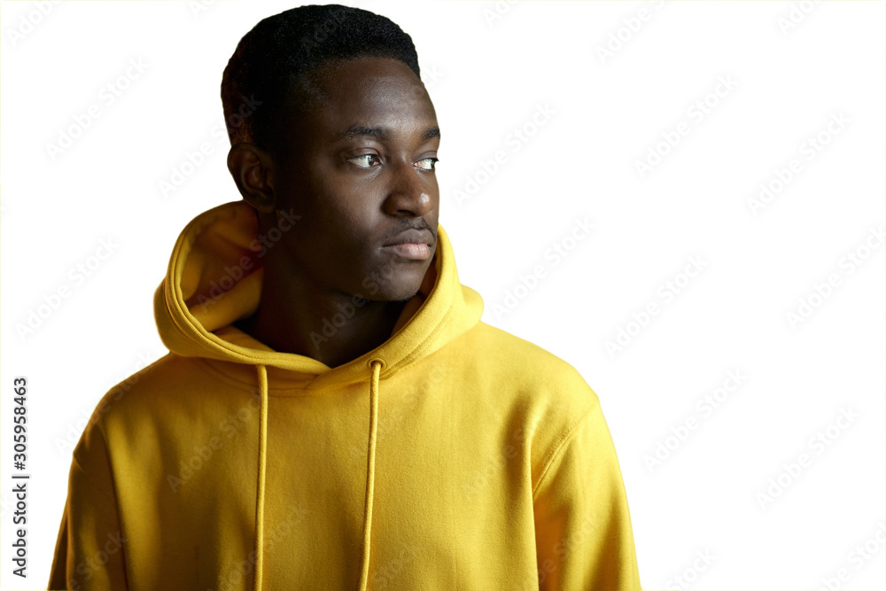 young black man in yellow hoodie Stock Photo | Adobe Stock
