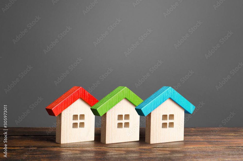 Multi-colored wooden houses. Affordable comfortable housing. Purchase ...