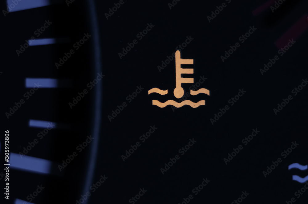 Lit yellow sign Overheating of the motor on the dashboard of the car ...