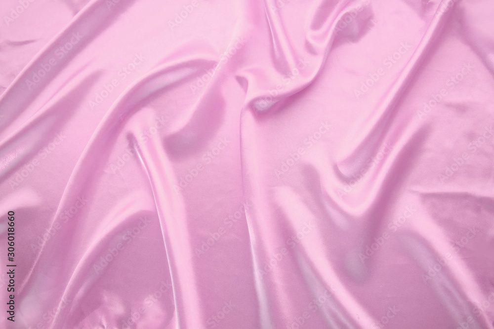 beautiful silk fabric of delicate pink color draped with small folds ...
