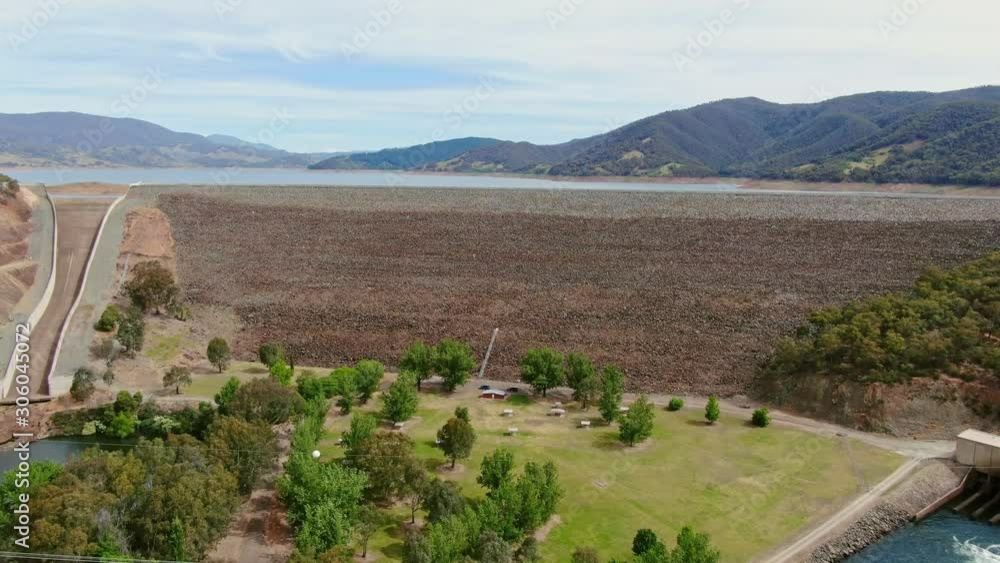 High angle aerial drone footage of Blowering Reservoir with dam wall ...