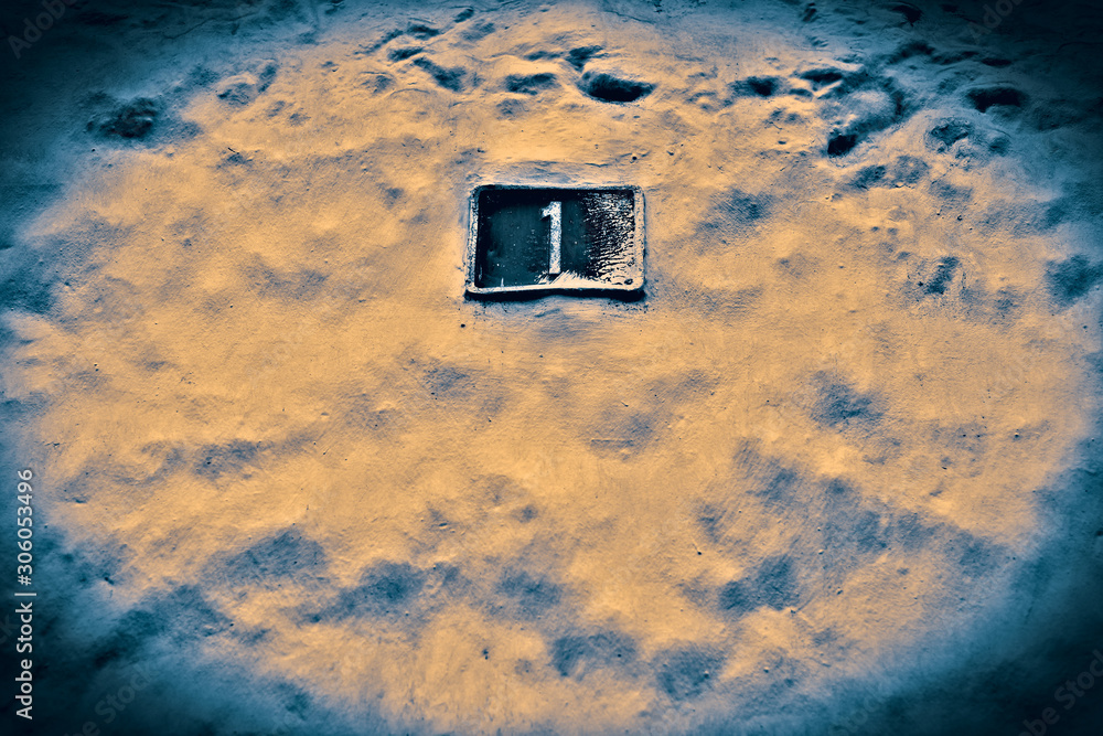 Number 1, one, plate on a wall - image with split toned effect and ...