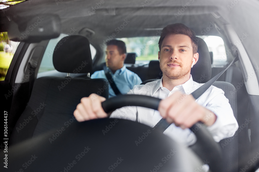 transport, vehicle and people concept - male driver with wireless ...