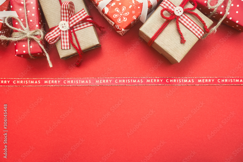 Different gift boxes on red background Stock Photo | Adobe Stock