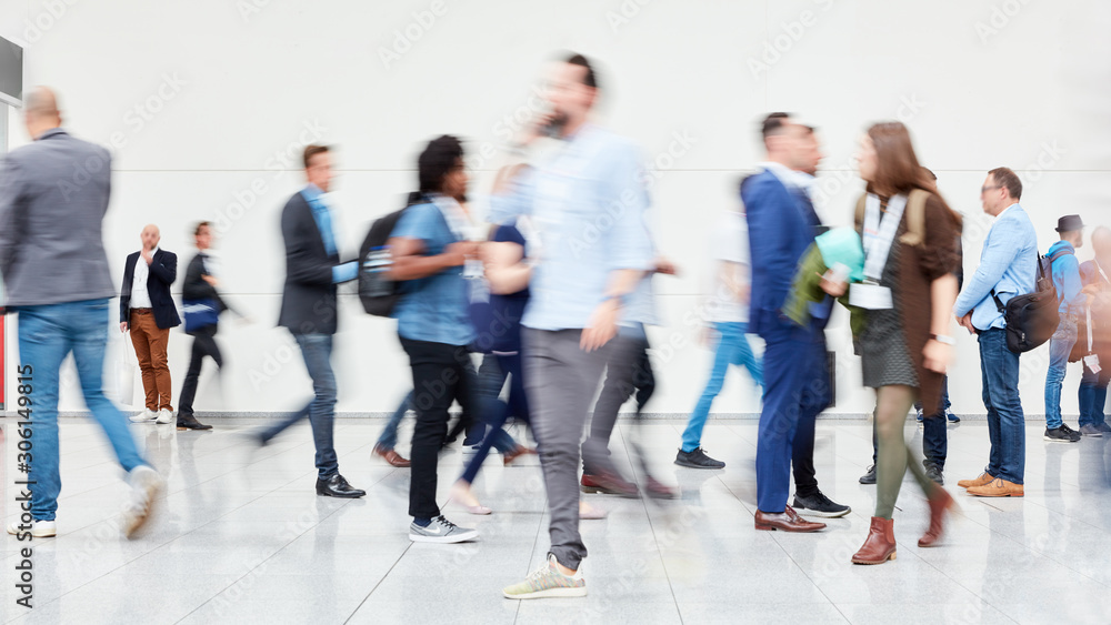 Anonymous business people go around on trade fair Stock Photo | Adobe Stock