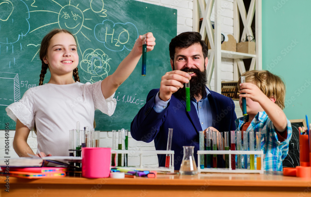 School club education. Teacher and pupils test tubes in classroom ...