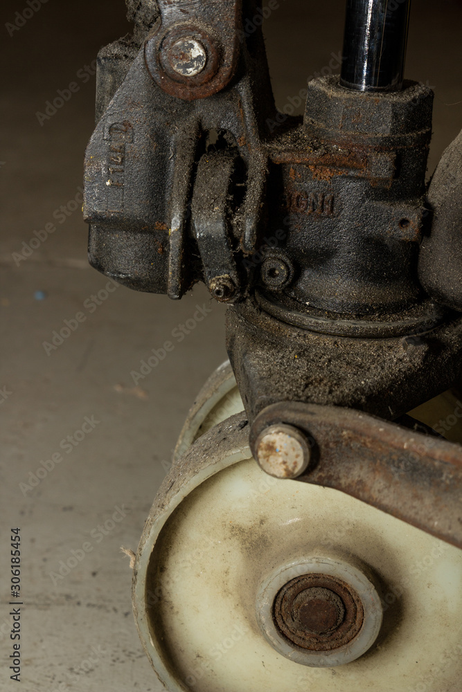 Hydraulic pump on the end of a yellow pallet truck, transporter ...