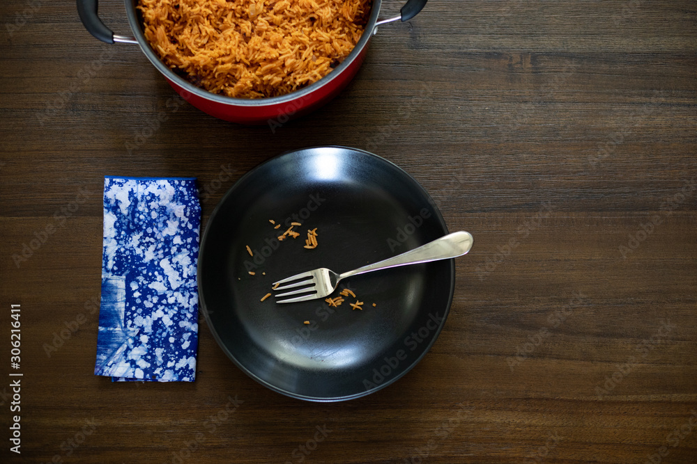 Empty plate of jollof rice Stock Photo | Adobe Stock