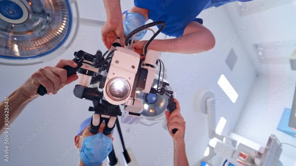 Hospital Operating Room. Doctor and assistant working in operating room ...