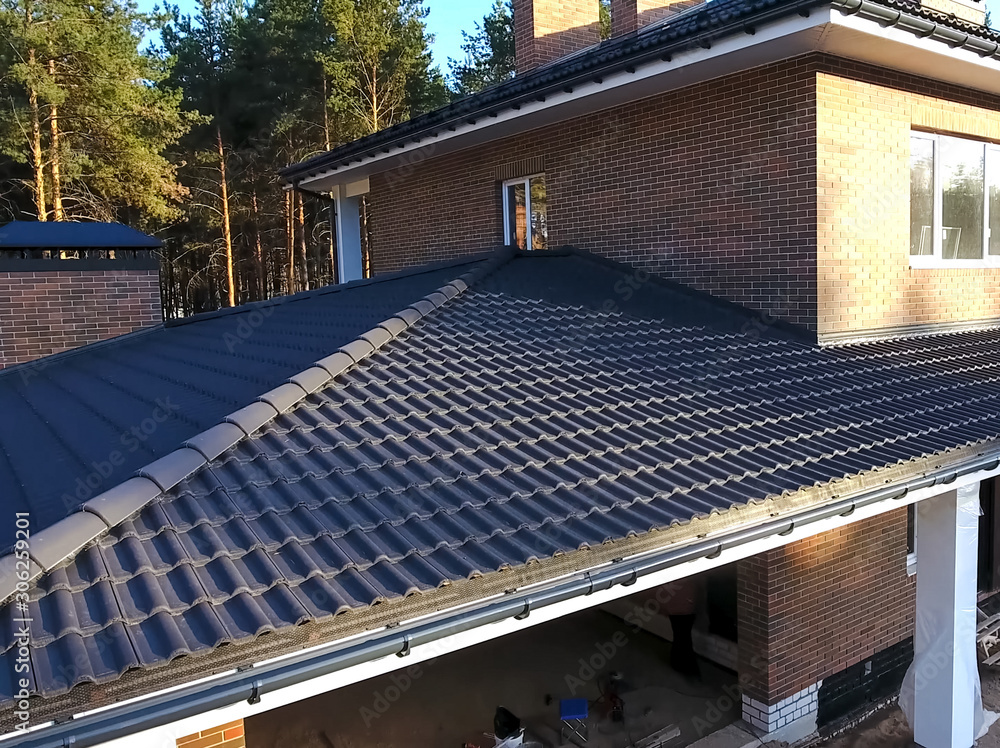 House with ceramic tile roof. cement-sand roof tiles. Stock Photo ...