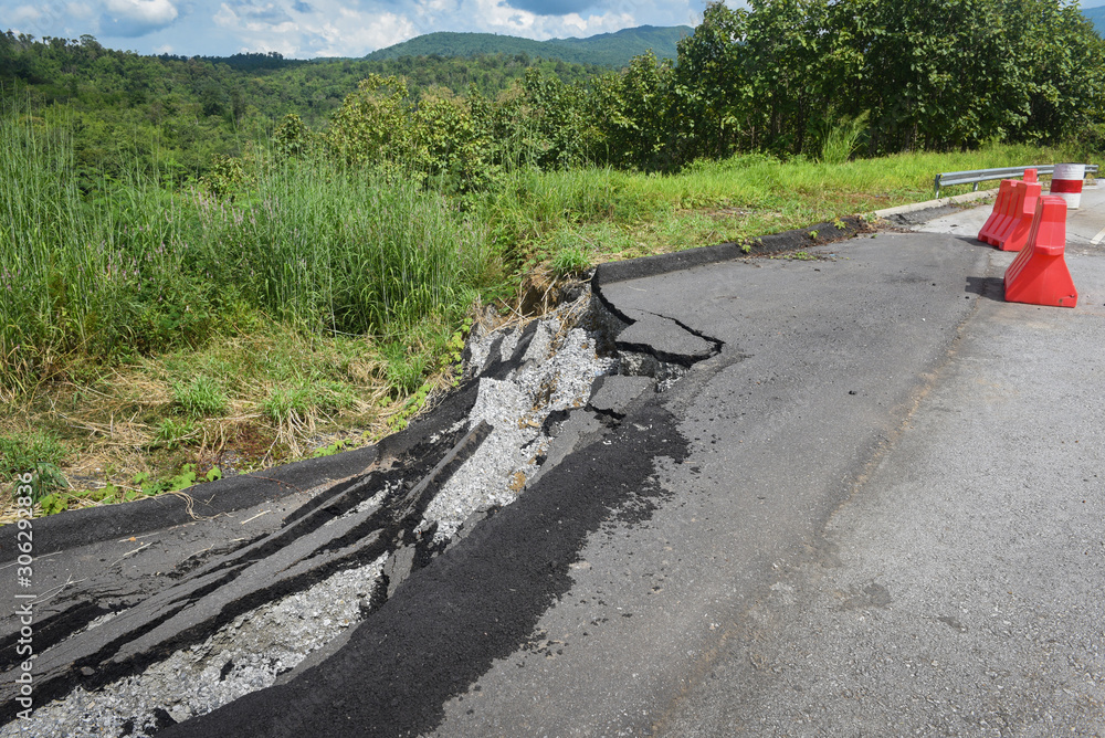 Asphalt road collapsed and cracks in the roadside - Road landslide ...